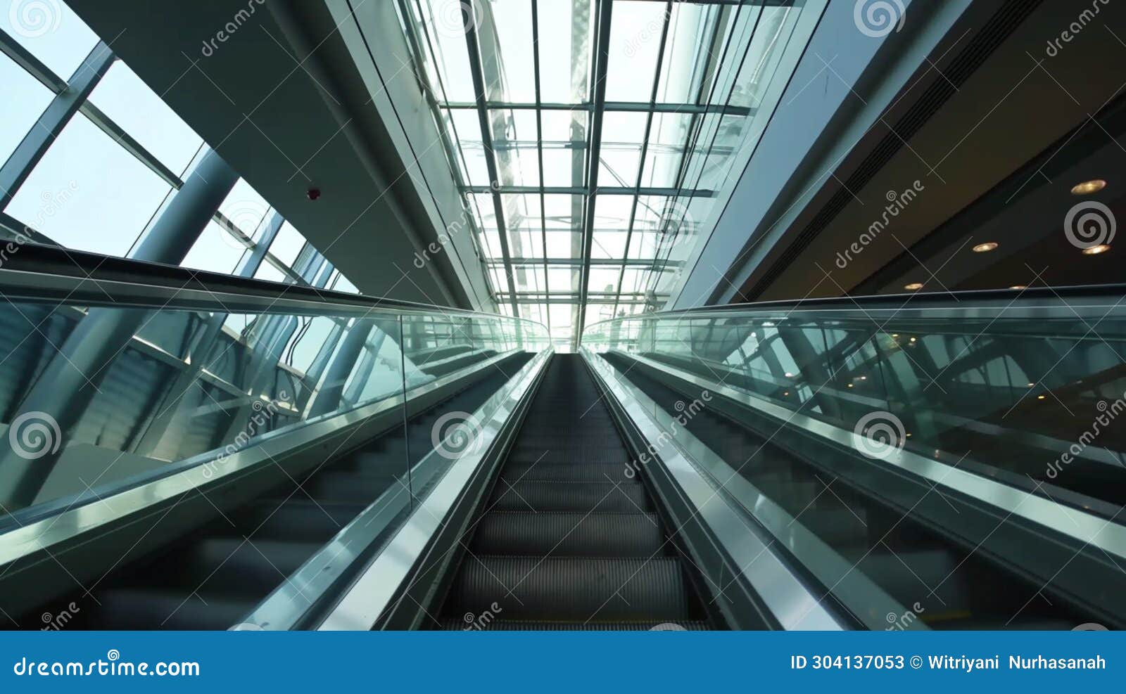 Side View of Escalator on Wall Background with Three Blank Light Boxes ...