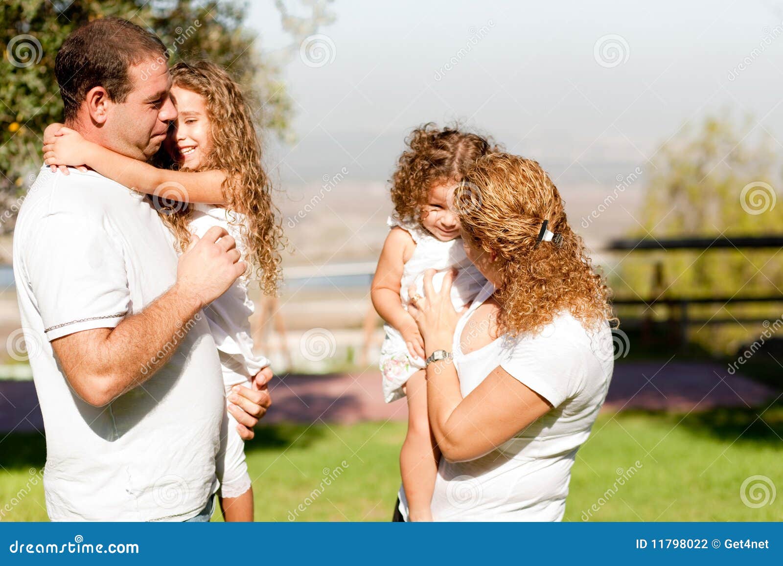 Side View of a Family in the Park Stock Photo - Image of laughter ...