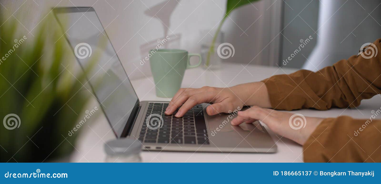 Hands Typing on Blank Screen Laptop on White Simple Worktable with Mug ...