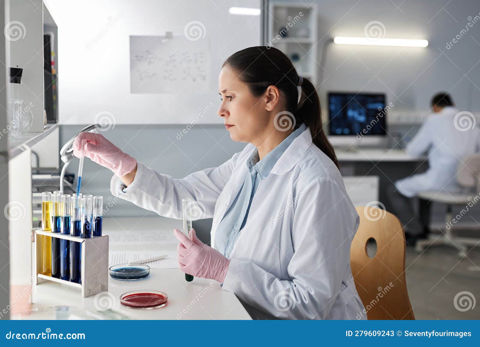 Side View Female Scientist Doing Tests at Workstation in Modern ...