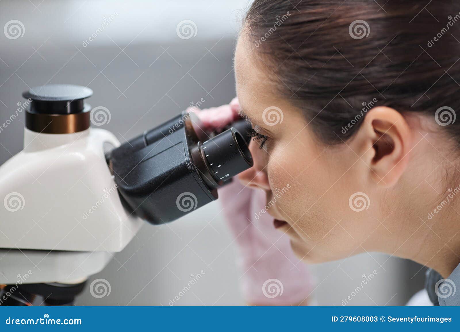 Side View Female Scientist Looking in Microscope in Laboratory Stock ...