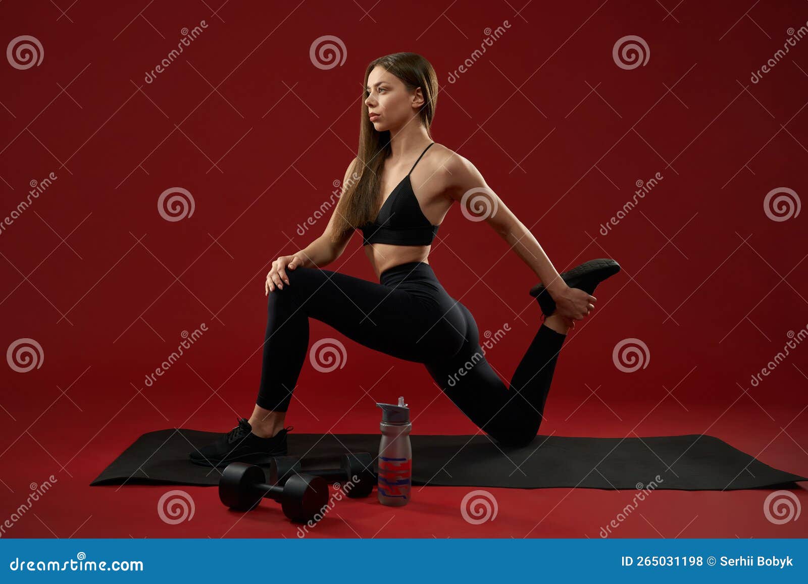 Side View of Flexibility Female Trainer Doing Stretching. Stock Photo ...