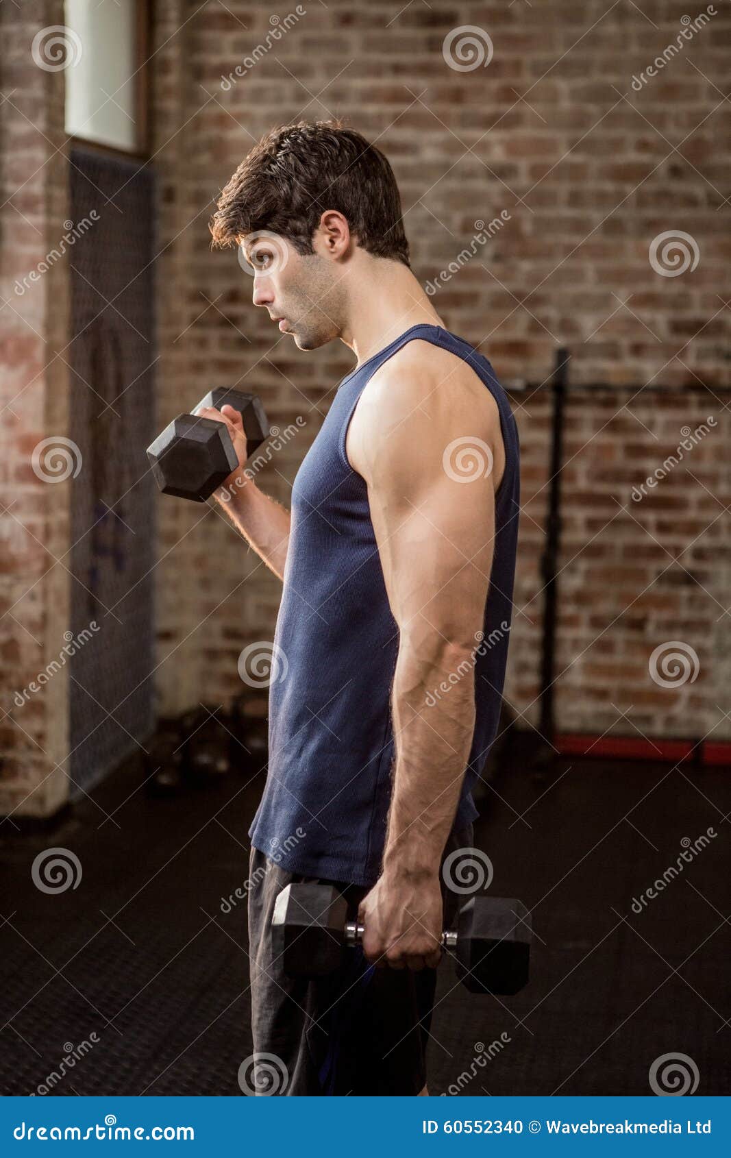 Side View of Focused Man Lifting Dumbbells Stock Photo - Image of class ...