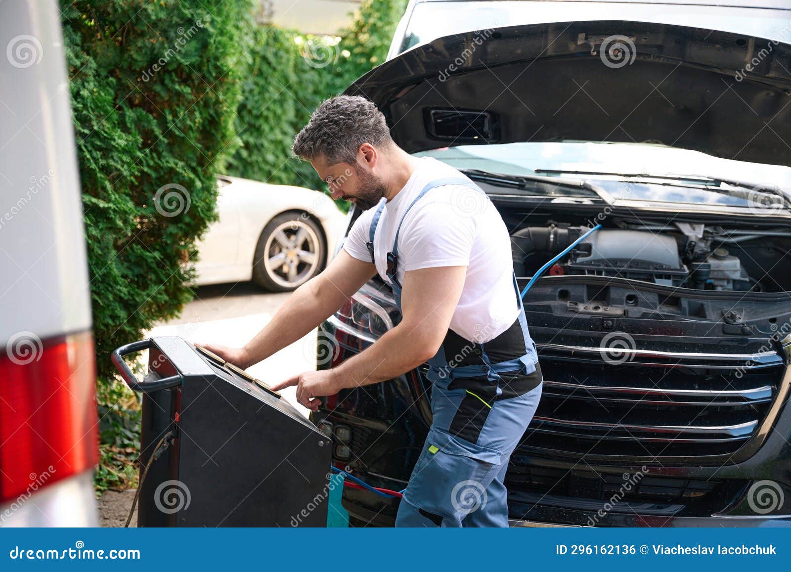 Experienced Auto Technician is Servicing Client Car Air Conditioning ...