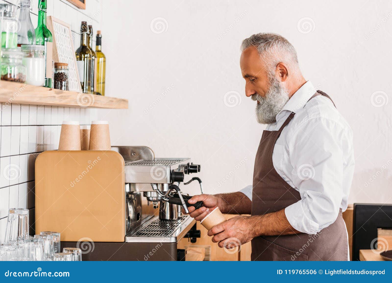 Side View Of Focused Senior Barista Using Coffee Machine While Royalty ...