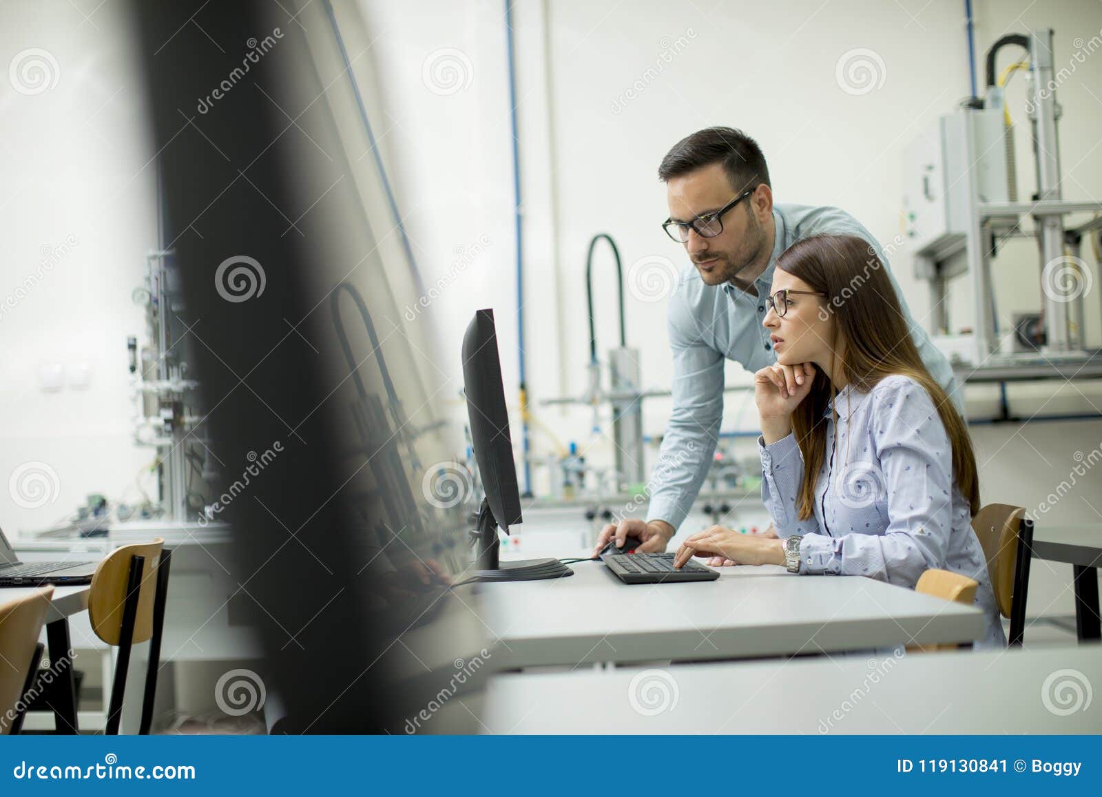 Side View of Focused Students Using Desktop Pc in Classroom Stock Image ...