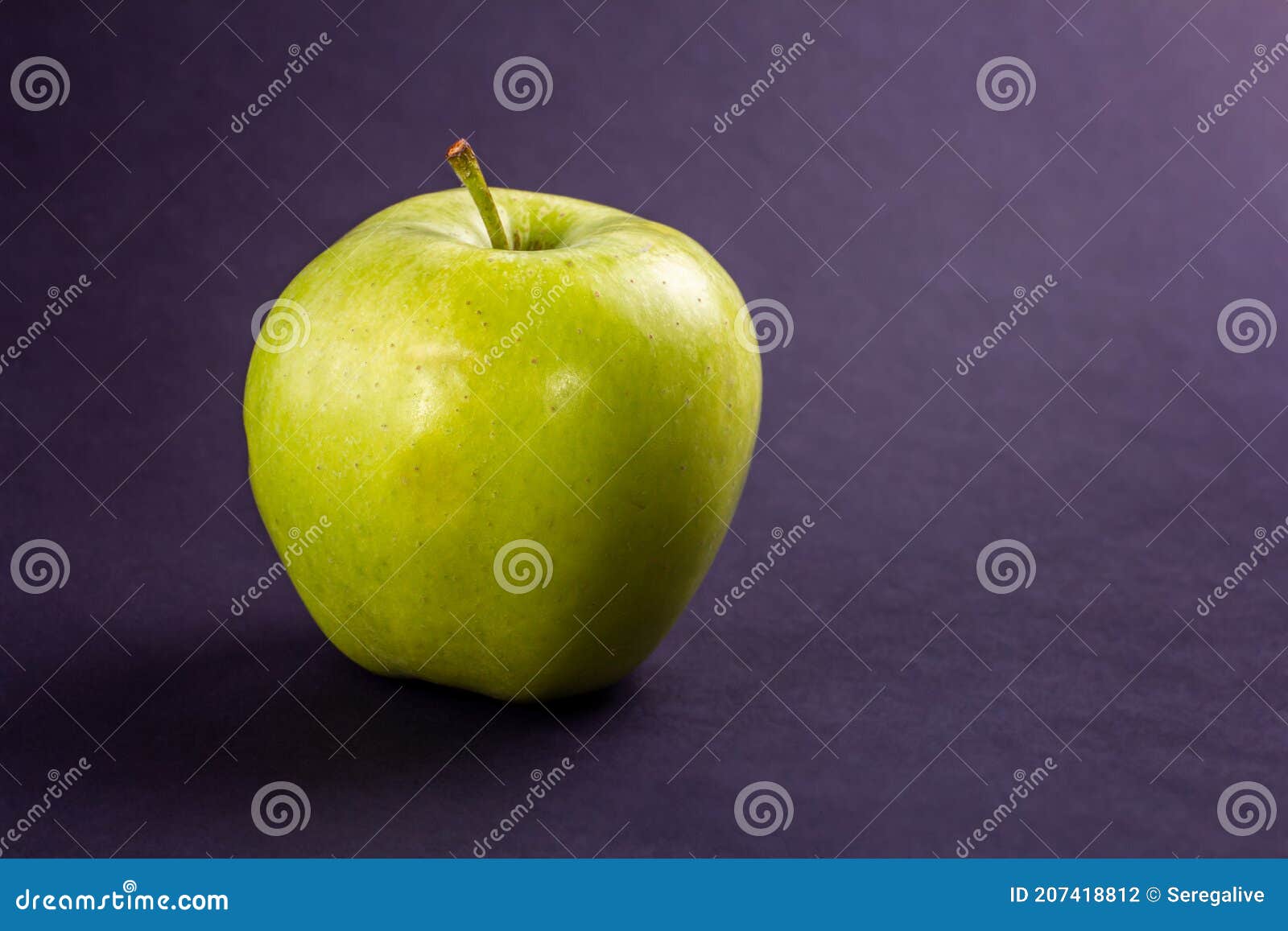 Side View of a Fresh Green Apple on a Black Textured Surface. Copy ...