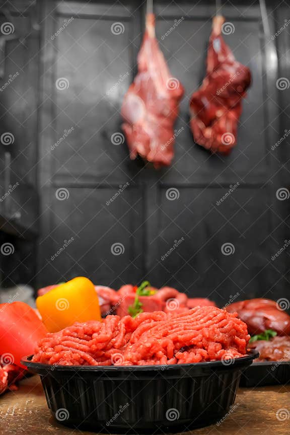 Side View of Fresh Minced Beef and Assorted Meats on Rustic Table with ...