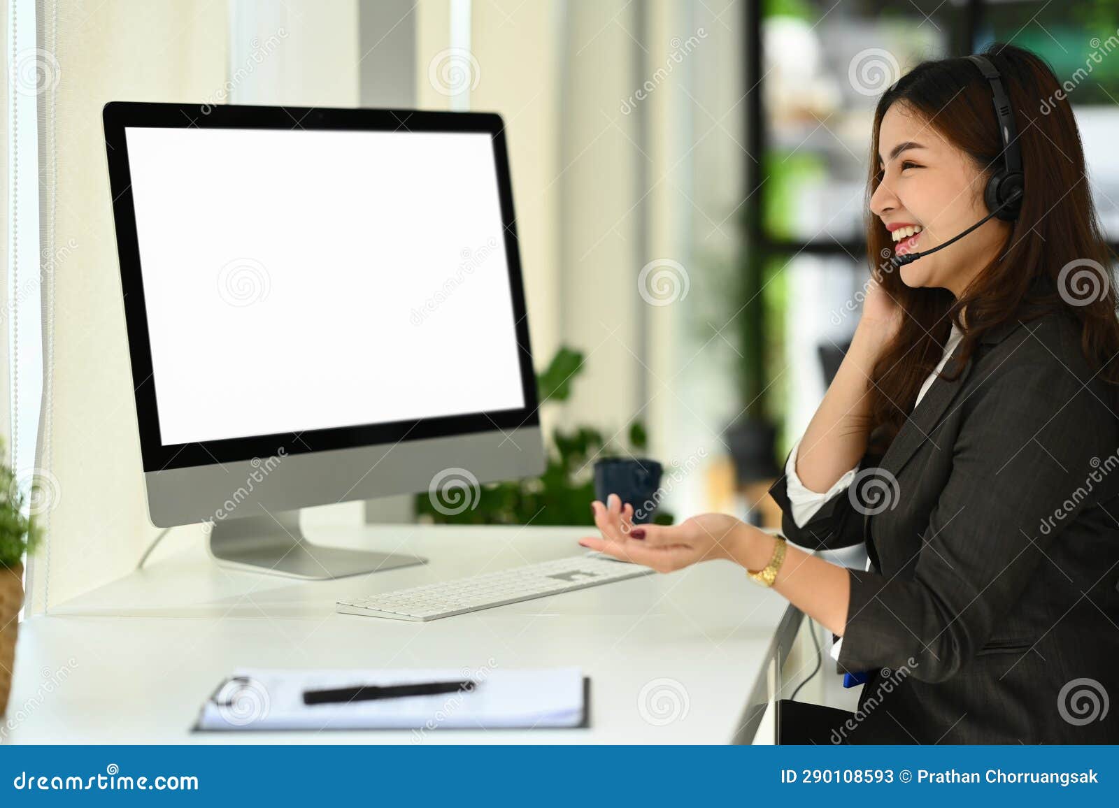 Side View of Friendly Telemarketer or Telesales Agent Using Headset ...