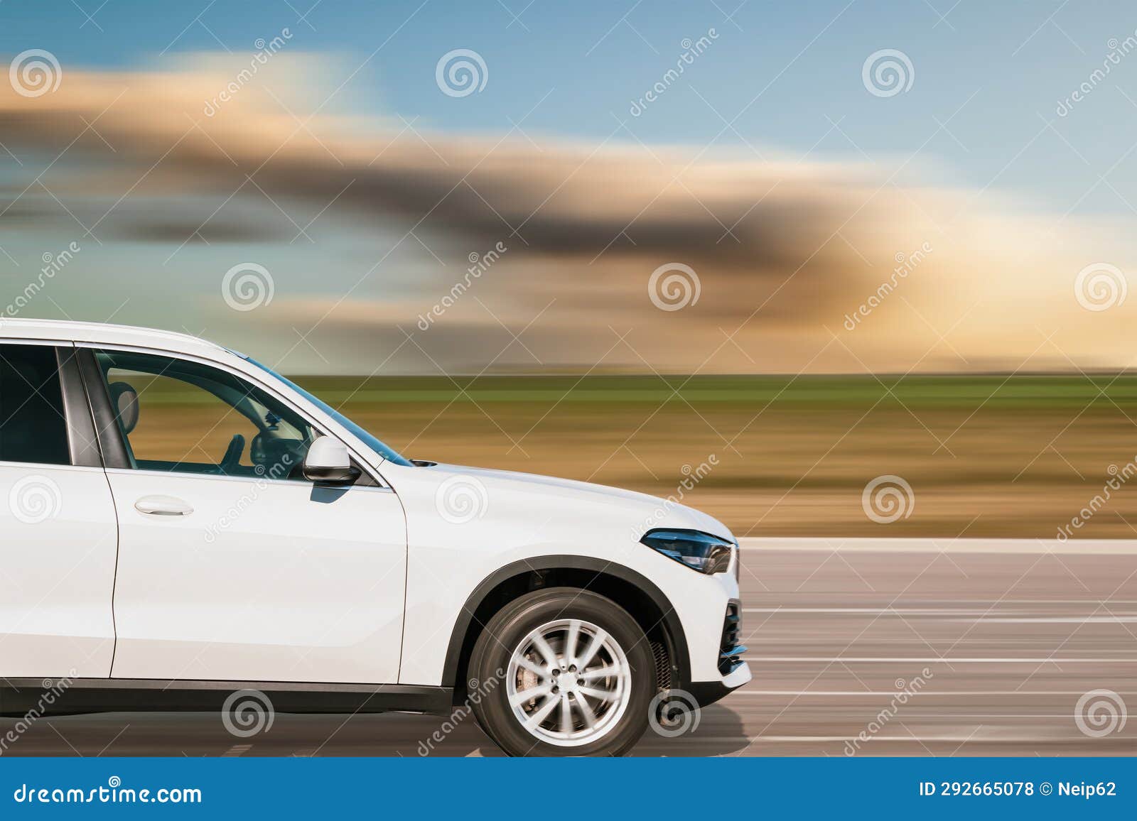Side View of the Front of a Fast Moving White Car. Speed Motion Blurred ...