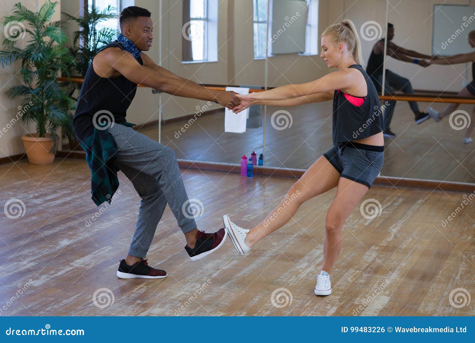 Side View Full Length of Dancers Practicing on Floor Stock Photo ...