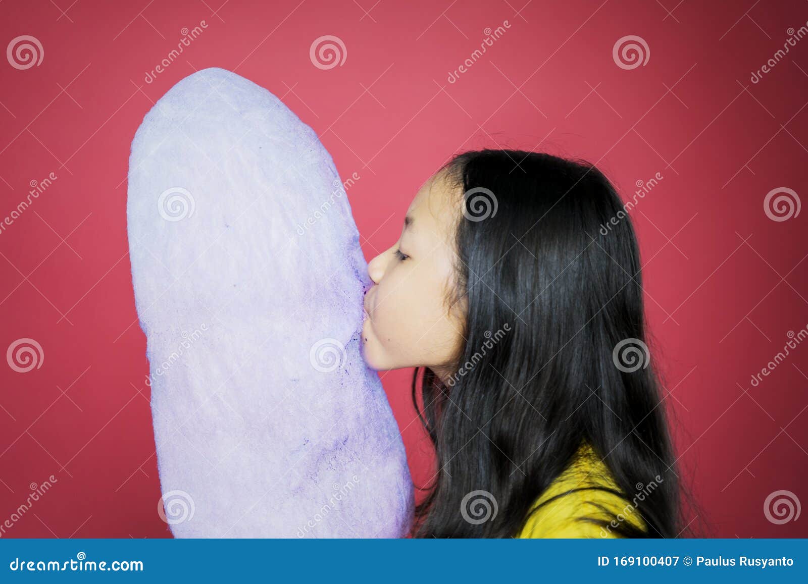Side View Of Girl Eating And Biting A Cotton Candy Stock Image Image Of Adorable Candy 169100407