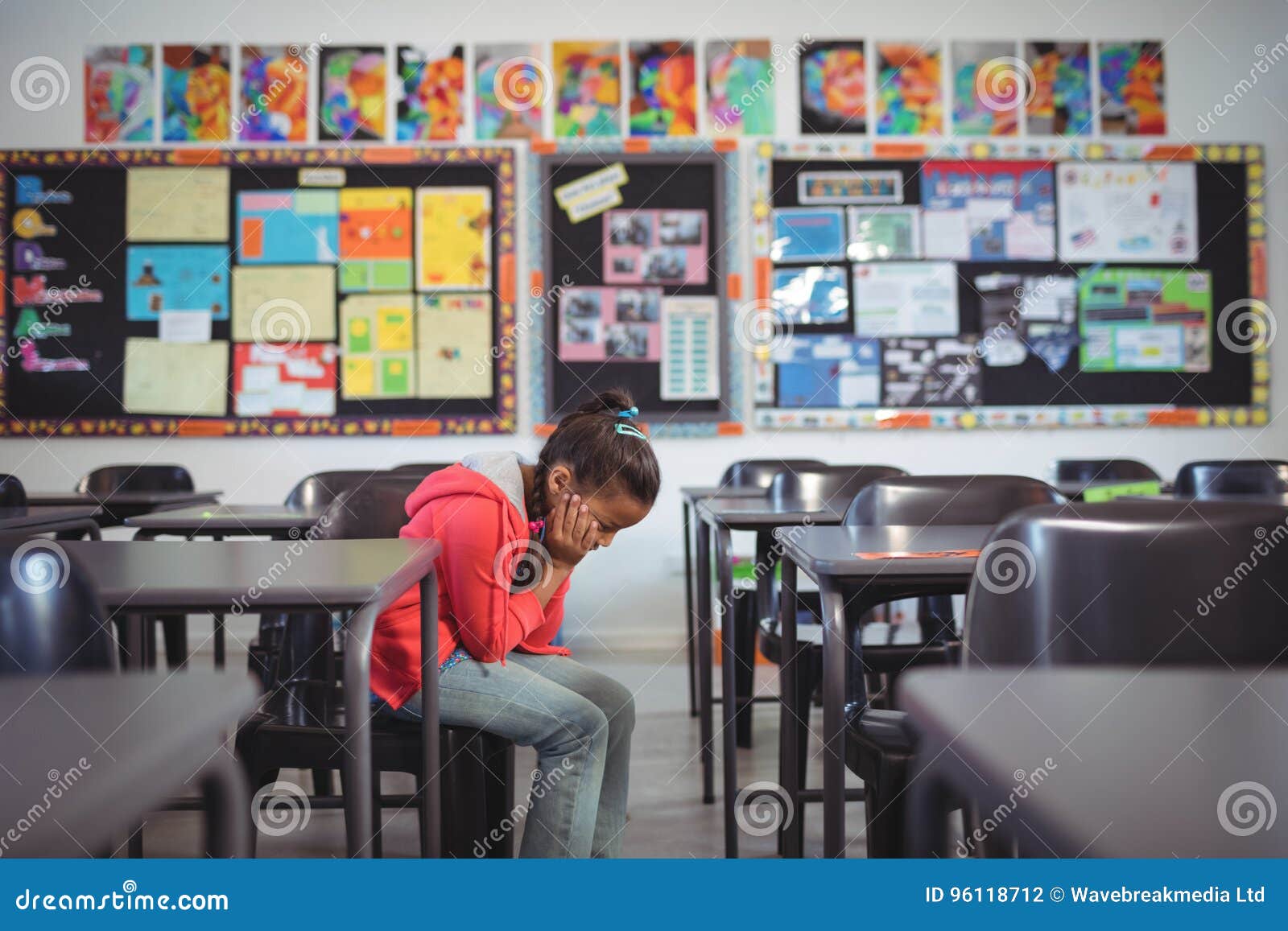 Side View of Girl Sitting on Chair in Classroom Stock Photo - Image of ...