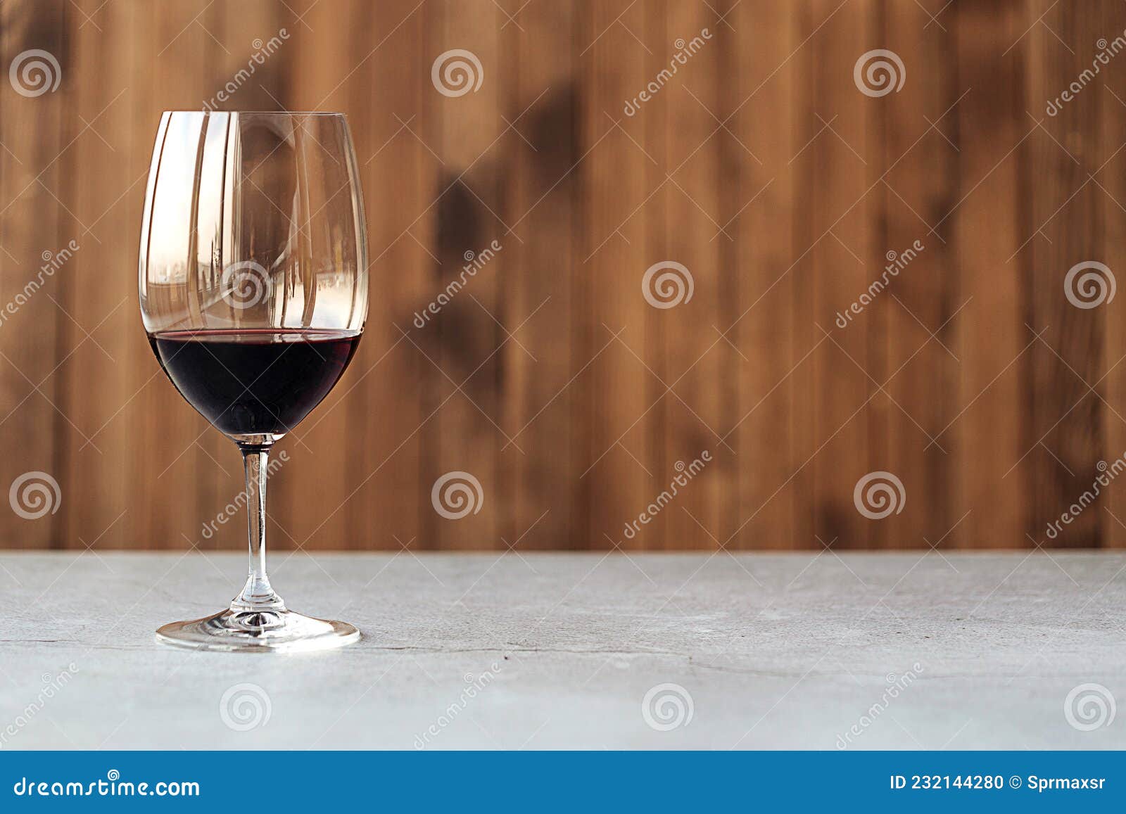 Side View on a Glass of Red Wine on the Table Stock Photo - Image of ...