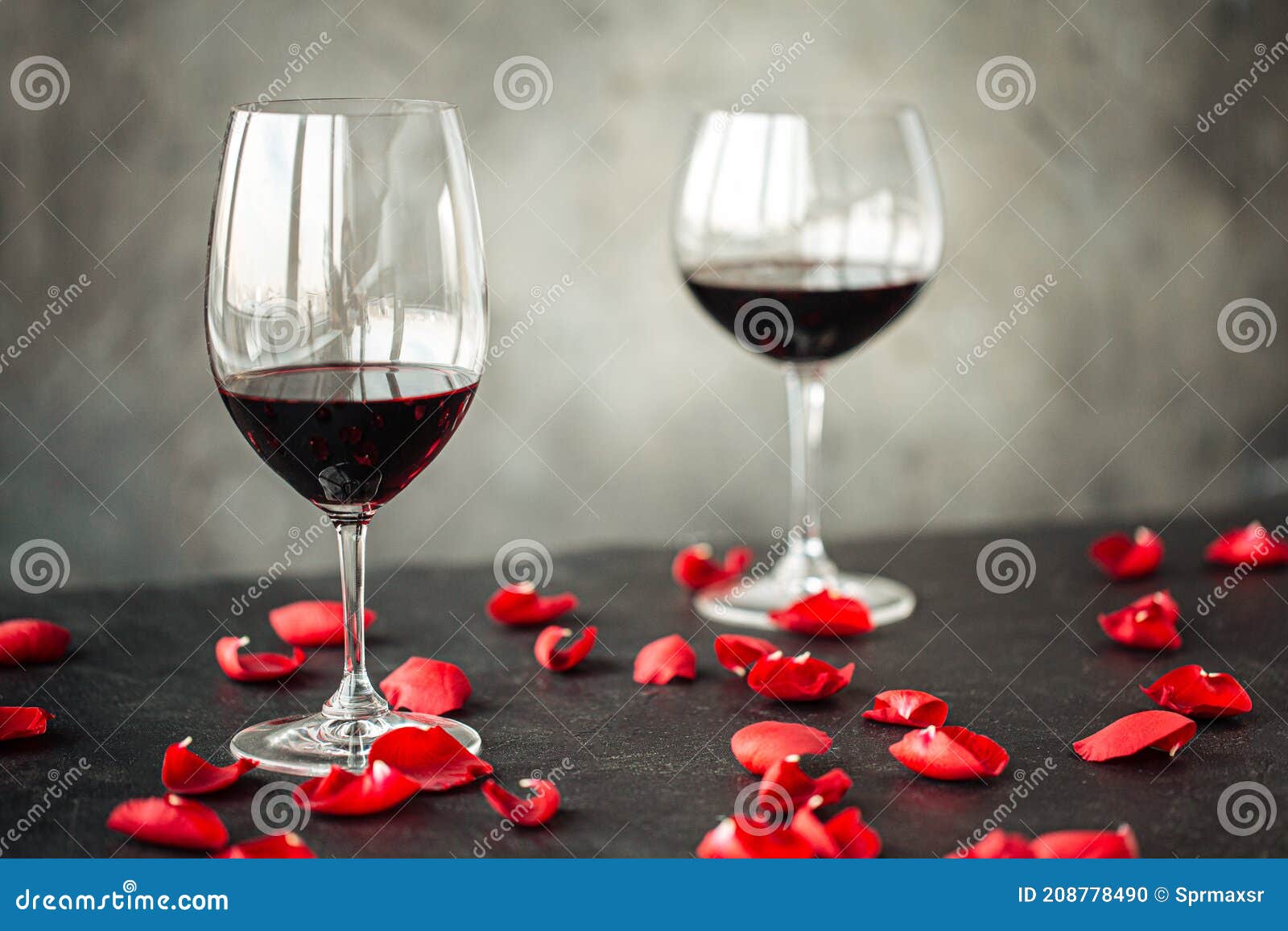 Side View on a Glasses of Red Wine with Petals Stock Photo - Image of ...