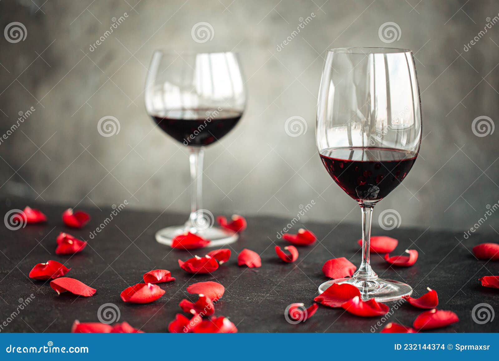 Side View on a Glasses of Red Wine with Petals Stock Photo - Image of ...