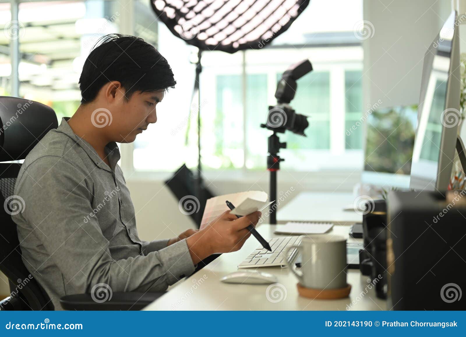 Side View of Graphic Designer or Photographer is Working on Color ...