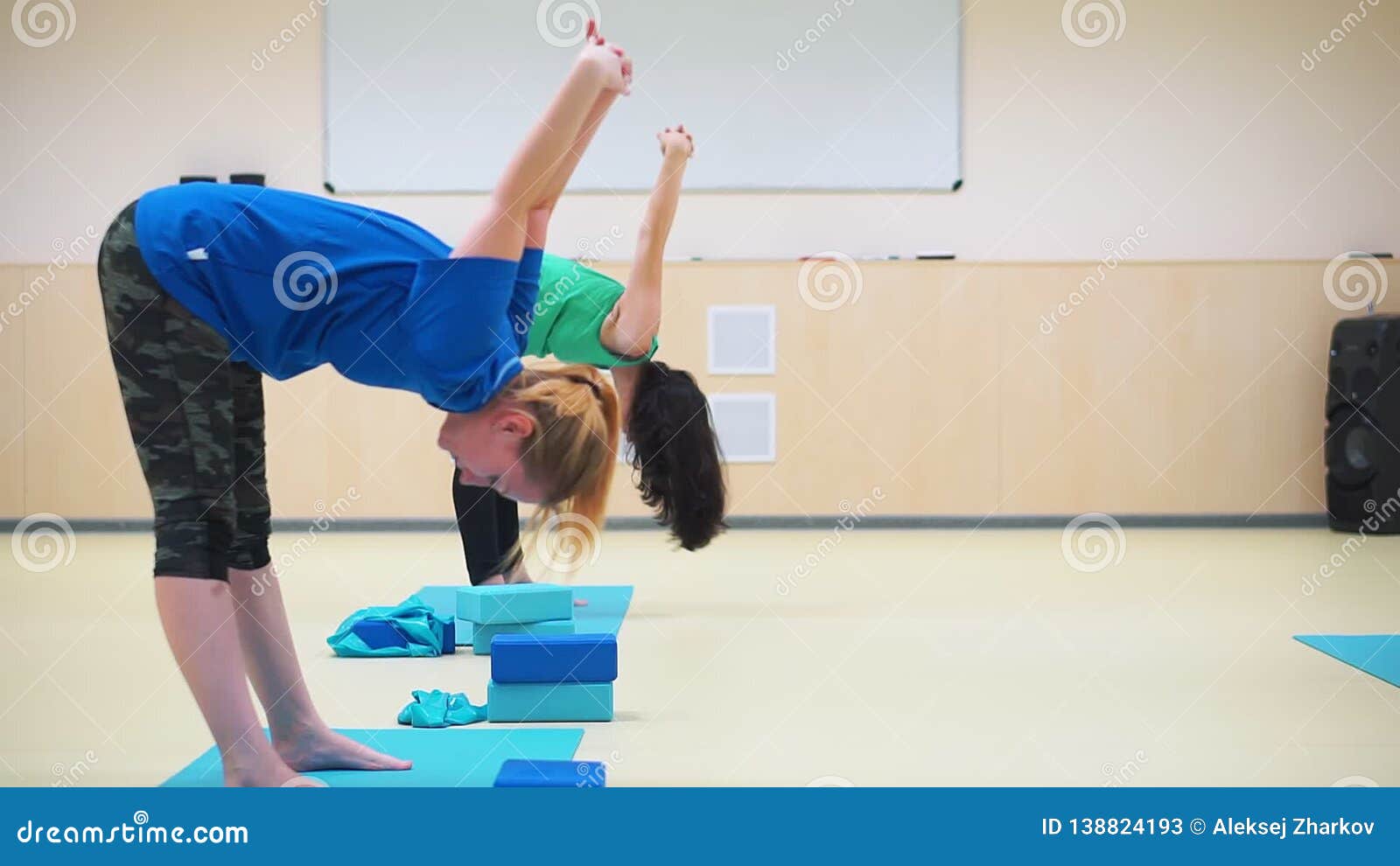 Side View a Group of Three Girls Doing Exercises - Stretch Hands Rubber ...