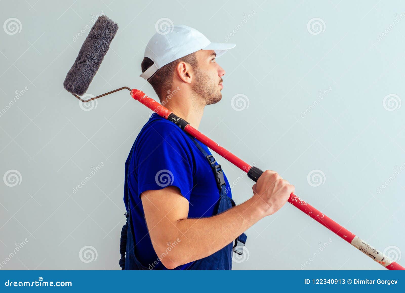 Side View of Workman Holding Paint Stick Roller Stock Image - Image of ...