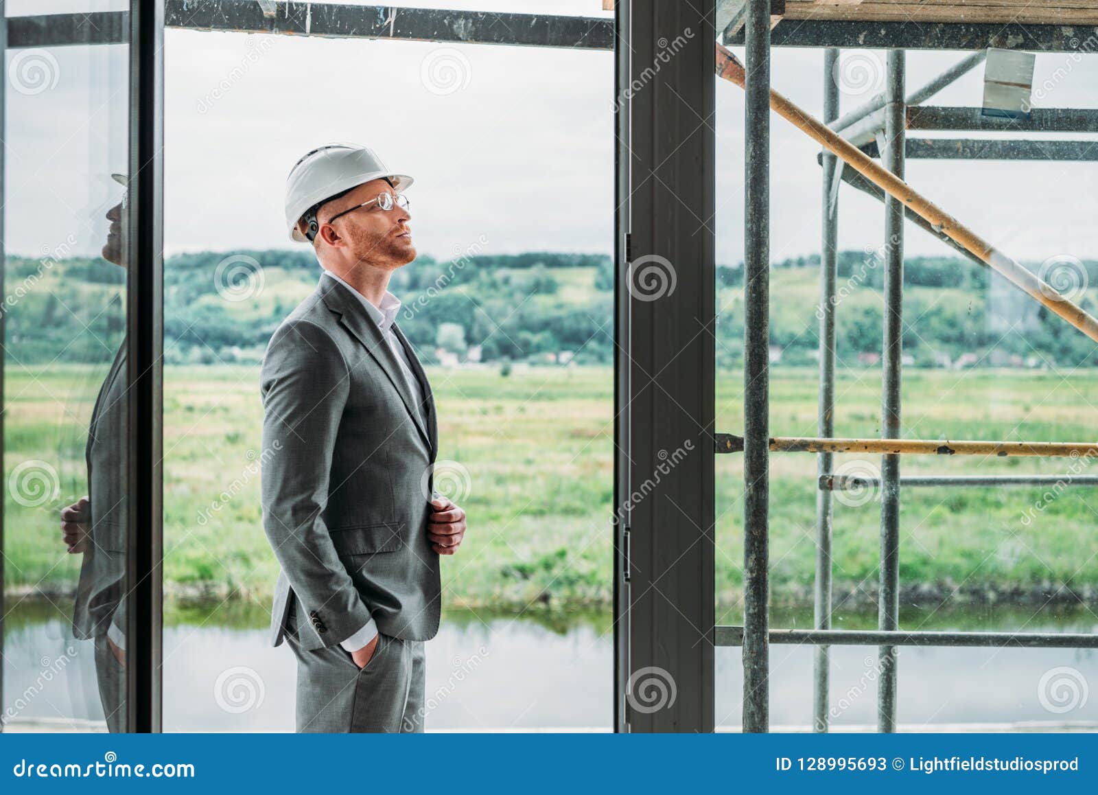 Side View of Handsome Architect in Suit and Hard Hat Standing on ...