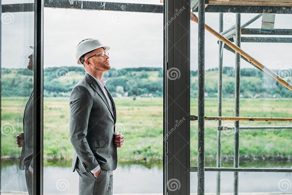Side View of Handsome Architect in Suit and Hard Hat Standing on ...