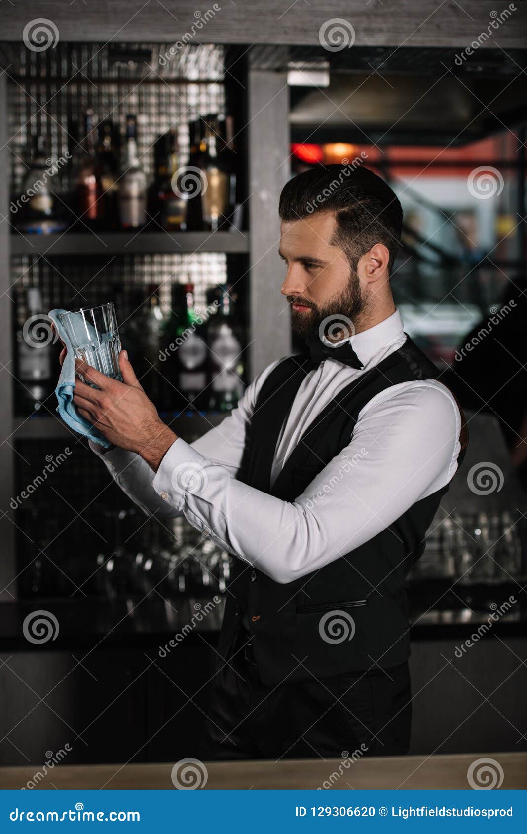 Side View of Handsome Bartender Cleaning Glass with Rag Stock Photo ...