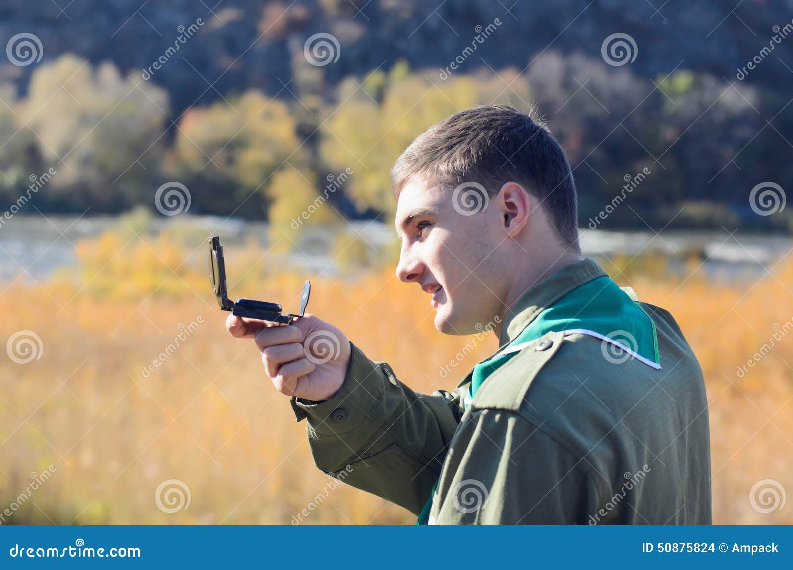 Side View of Handsome Boy Scout Navigating Compass Stock Photo - Image ...