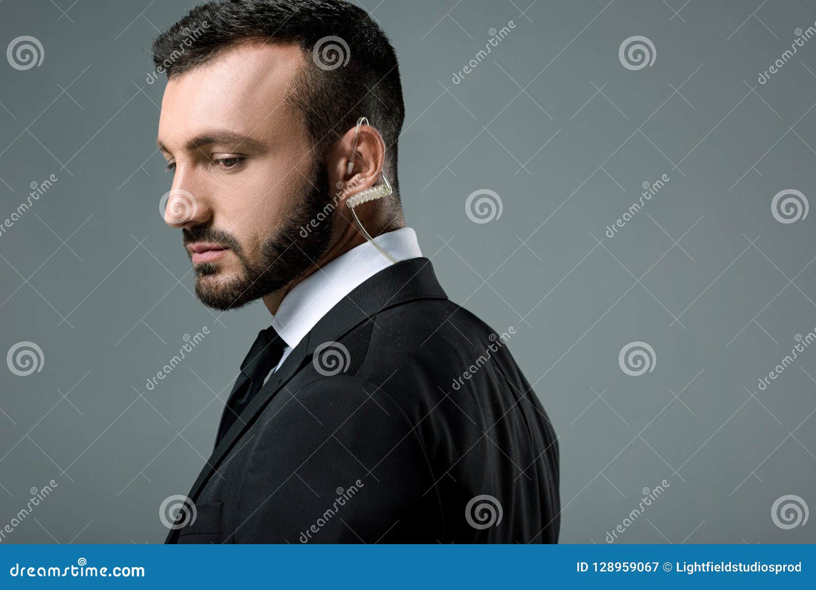 Side View of Handsome Security Guard with Security Earpiece Stock Image ...