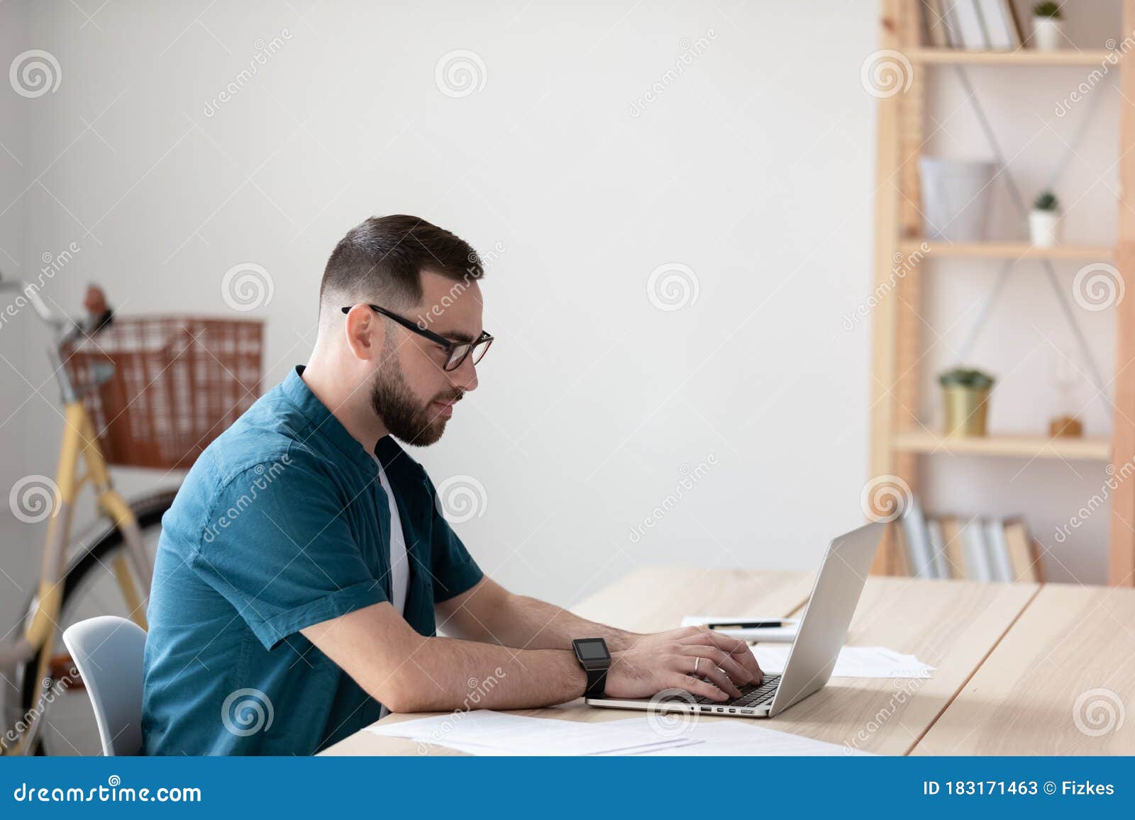 Side View Handsome Young Businessman Typing on Keyboard Using Laptop ... Side View Handsome Young Businessman Typing on Keyboard Using Laptop ...