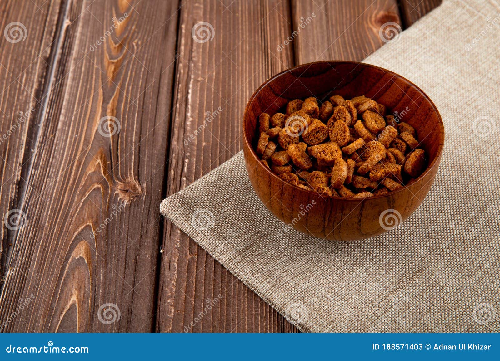 Side View Hard Chuck on the Right in Bowl with Copy Space on Wooden ...