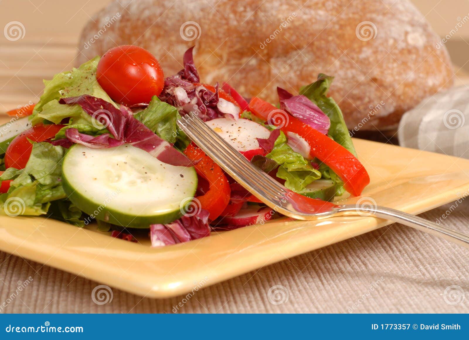 Side View of a Healthy Salad on a Yellow Plate with Rustic Bread Stock ...
