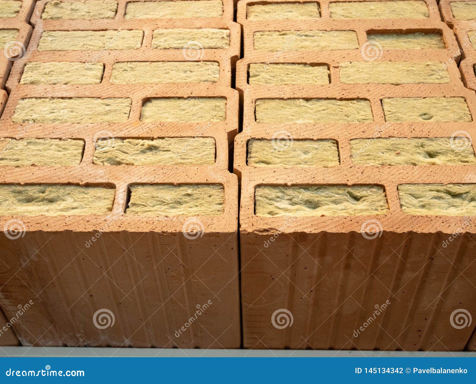 Side View on Hollow Red Bricks with Mineral Wool for Insulation Stock ...