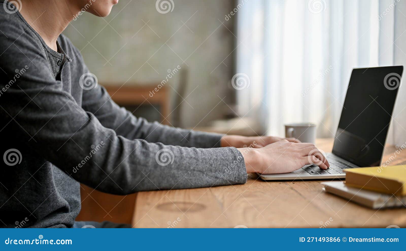 Side View Image of a Young Asian Man Typing on Keyboard, Using Laptop ...