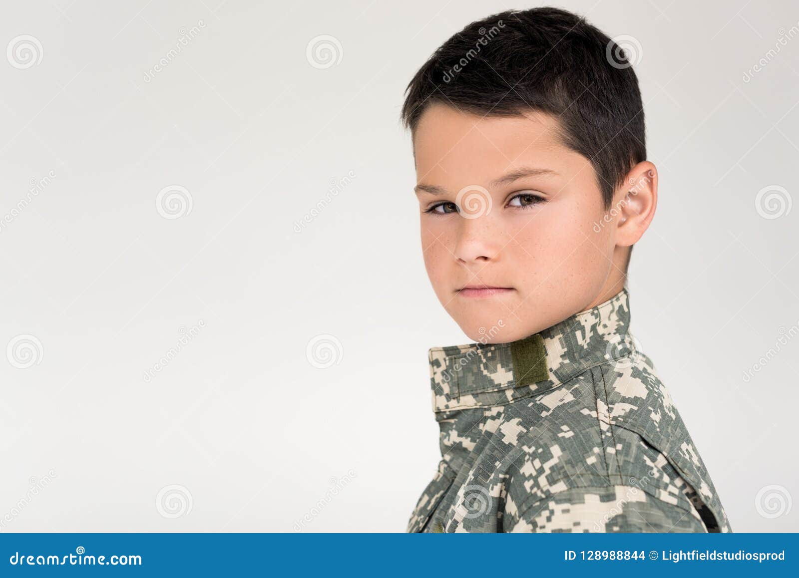 Side View of Kid in Military Uniform Looking at Camera Stock Photo ...