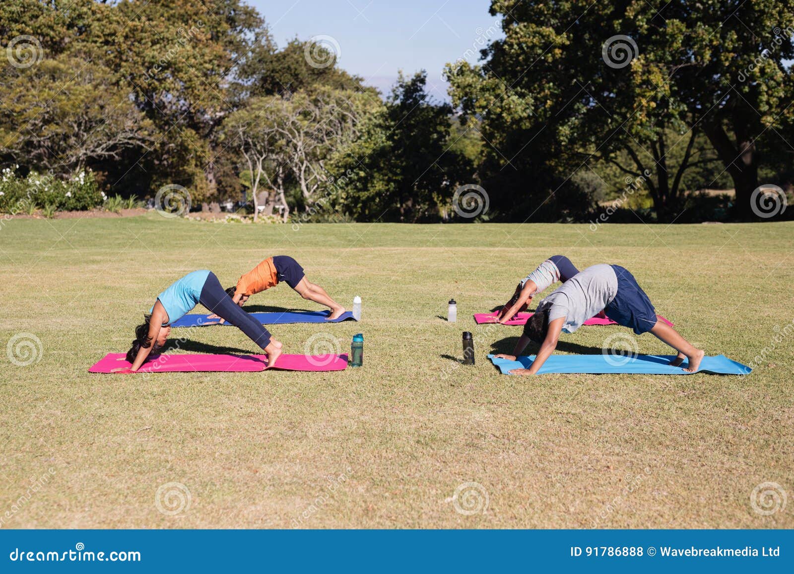 Side View of Kids Practicing Downward Facing Dog Pose Stock Photo ...