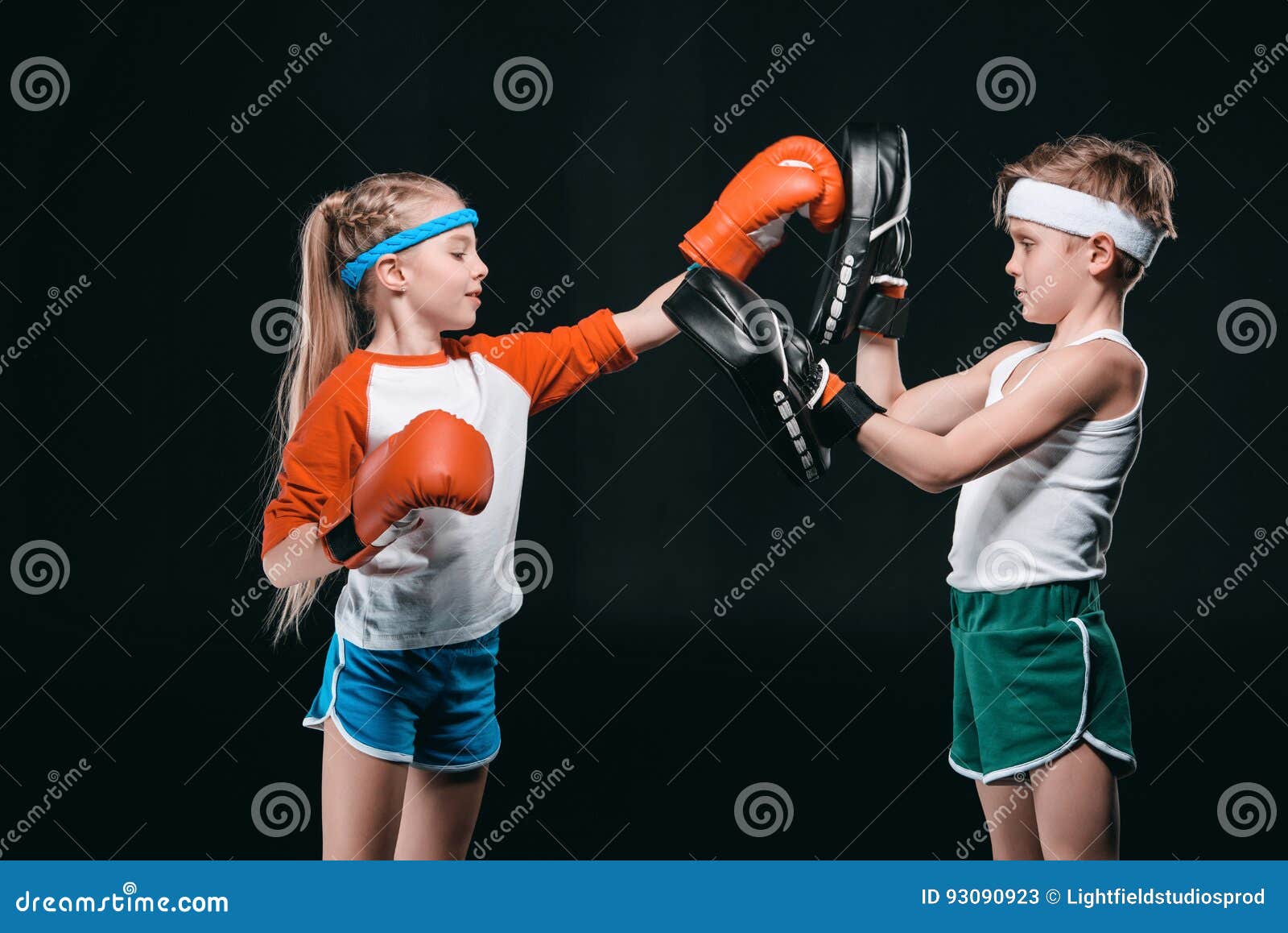 Side View of Kids Pretending Boxing Isolated on Black Stock Image ...