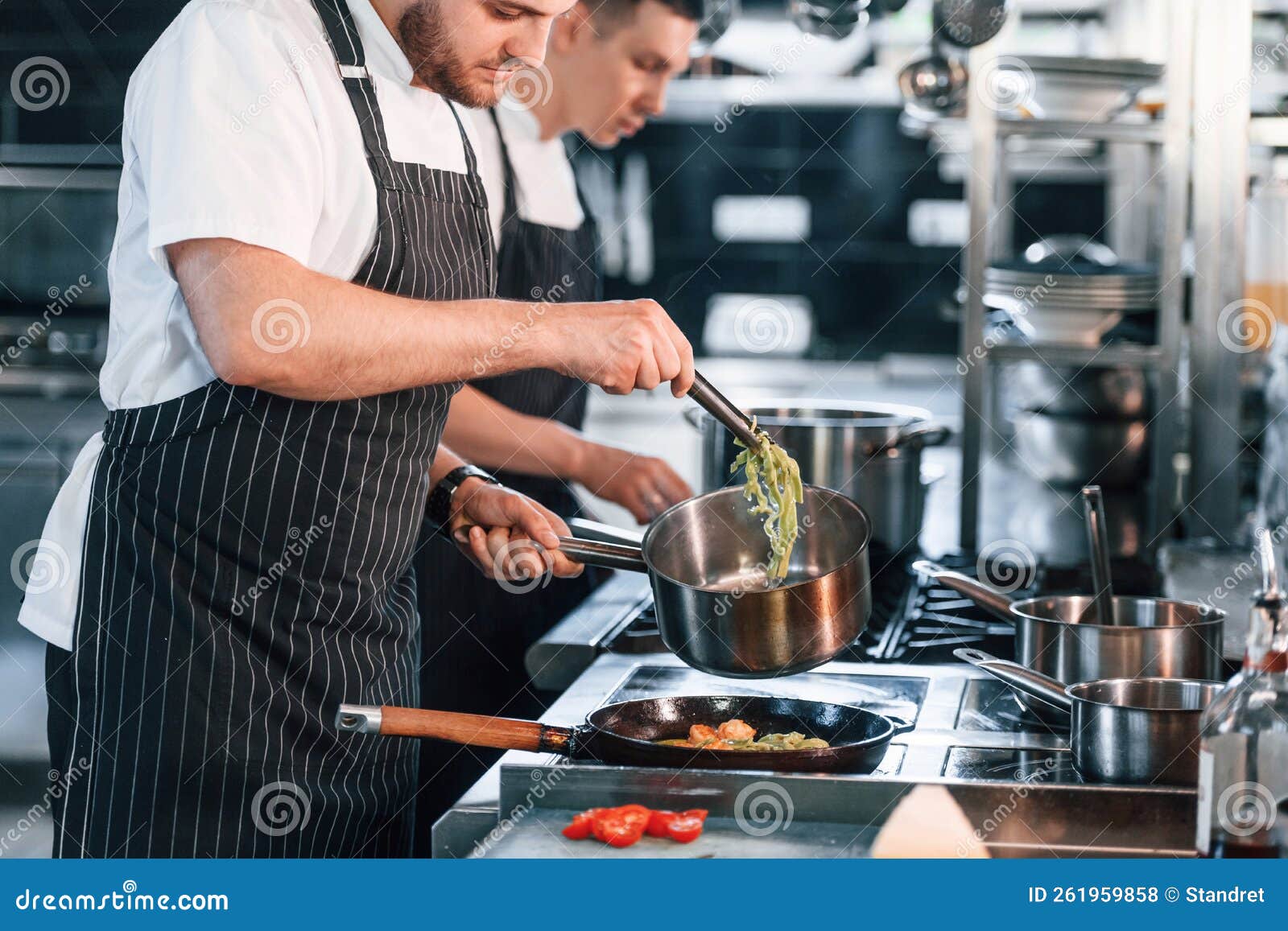 Side View. Kitchen Workers is Together Preparing the Food Stock Photo ...