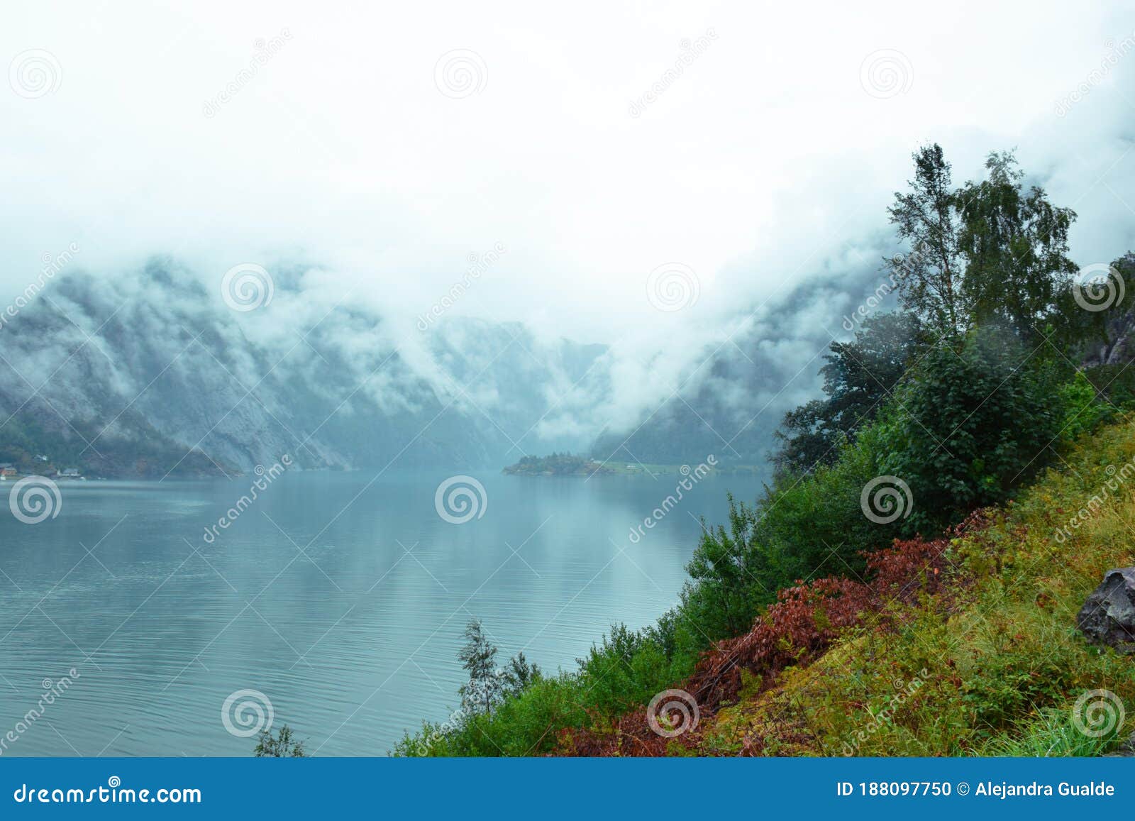 Side View of a Lake with Mountains in the Background Stock Photo ...