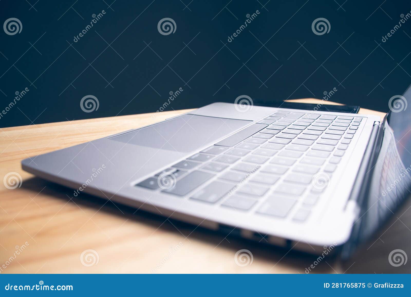 Side View Laptop with Blank Screen, Placed on a Wooden Table in Office ...