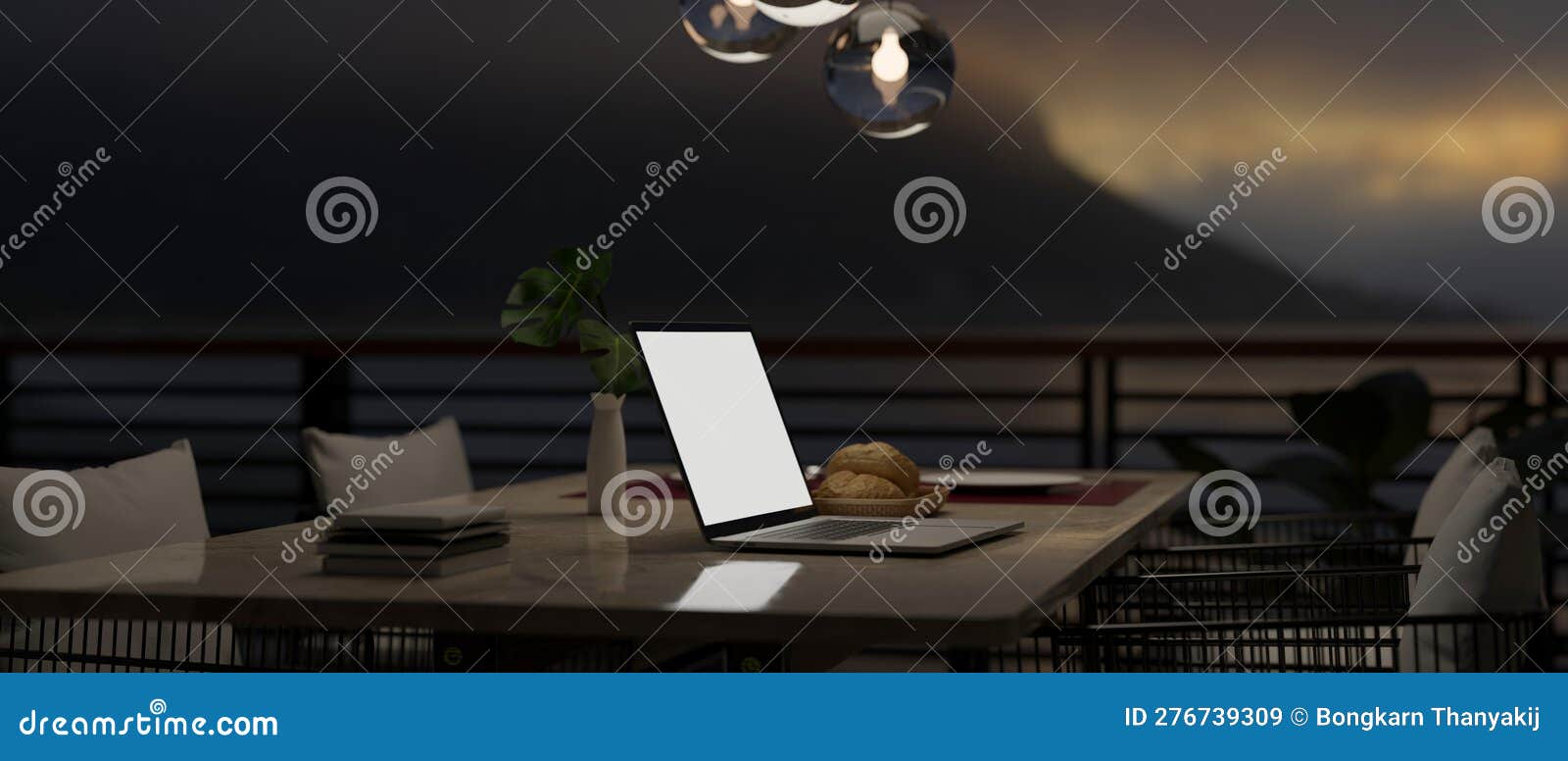 Side View of a Laptop Computer Mockup is on an Outdoor Dining Table in ...