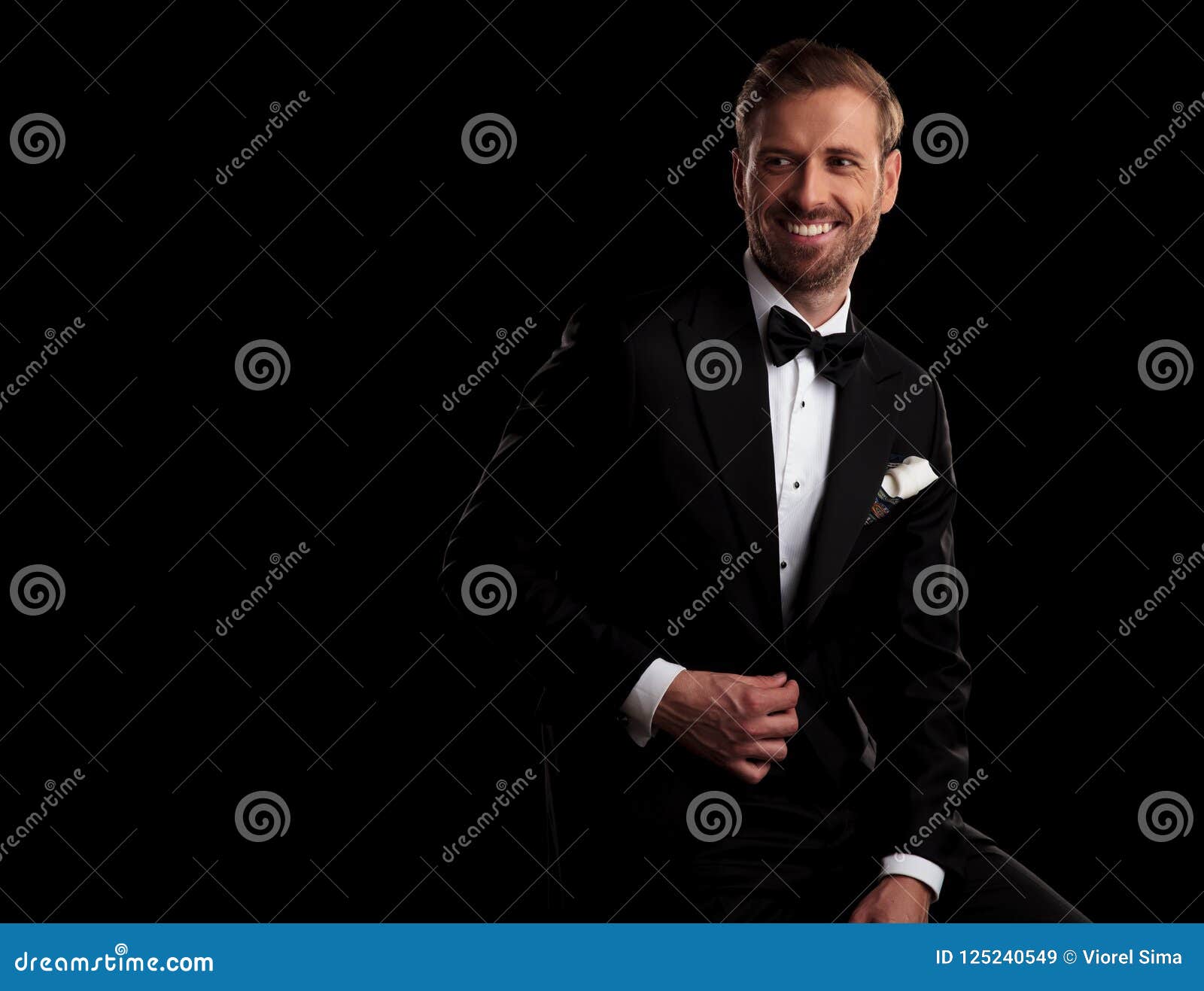 Side View of Laughing Elegant Man in Tuxedo Holding Button Stock Image ...