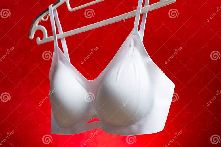 Light Blue Bra Hanging on Red Background Stock Image - Image of cotton ...