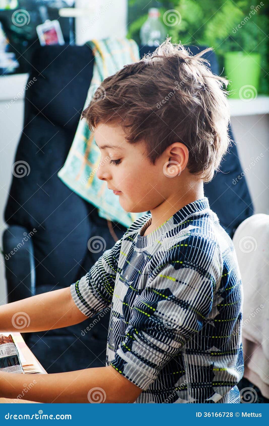 Side View of a Little Boy at Table in the Room Stock Photo - Image of ...