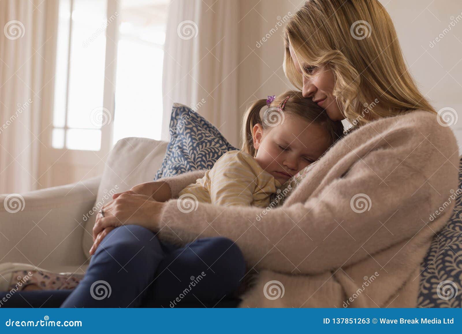Mother Embracing Her Sleeping Daughter In Arms Stock Image Image Of