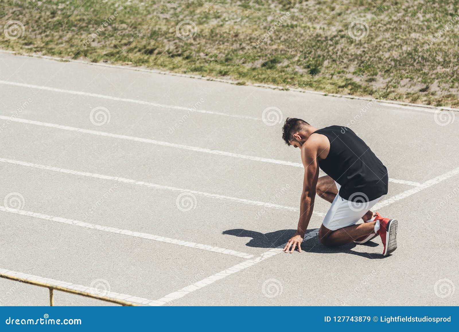 Side View of Male Sprinter in Starting Position on Running Stock Image ...