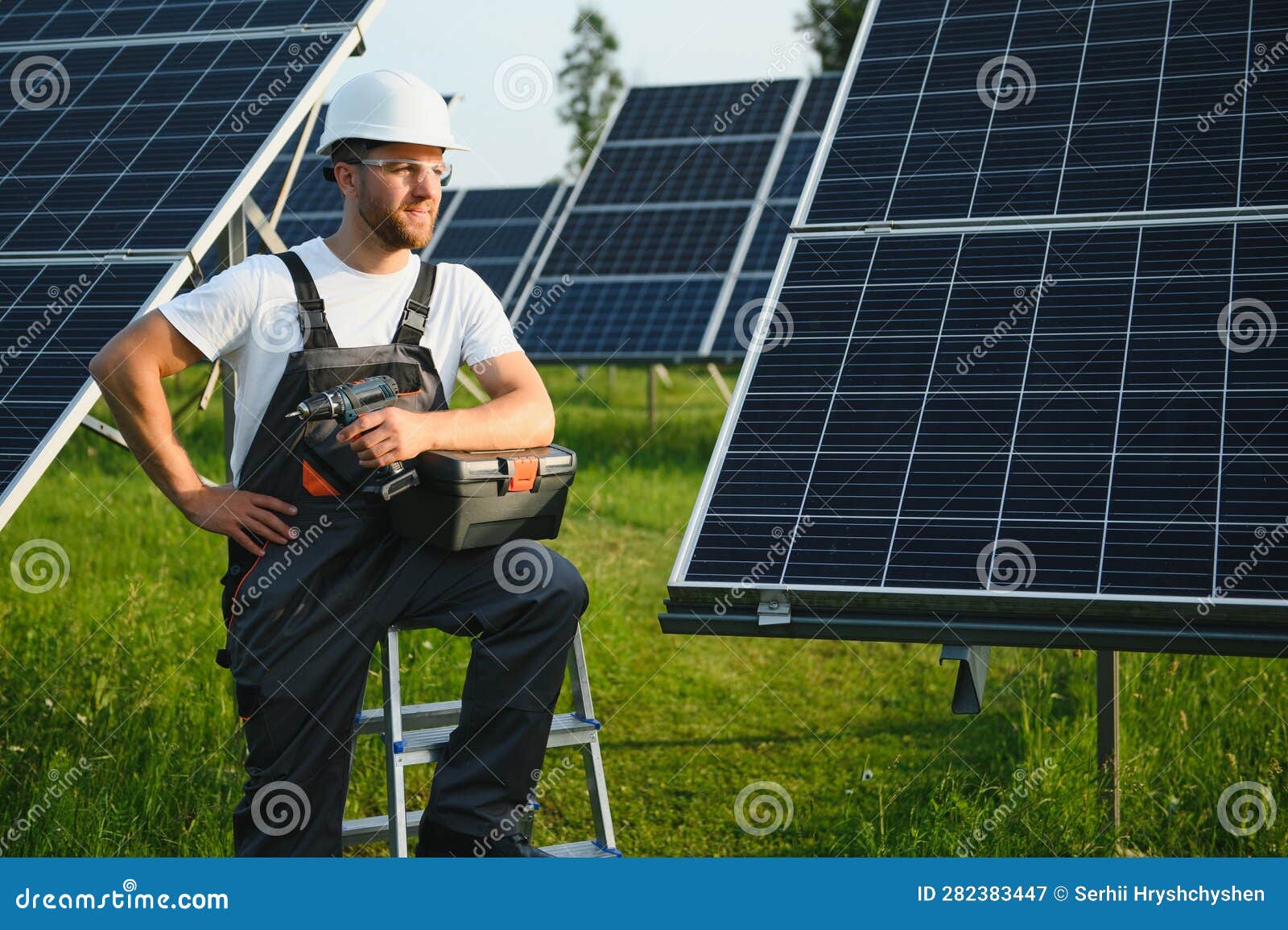 Side View of Male Worker Installing Solar Modules and Support ...