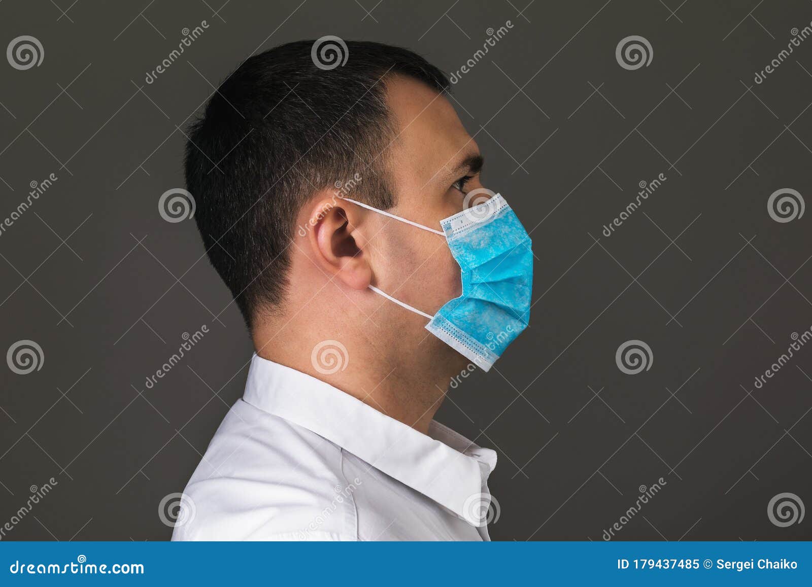 Side View of Man in Disposable Medical Mask on Gray Background Stock ...