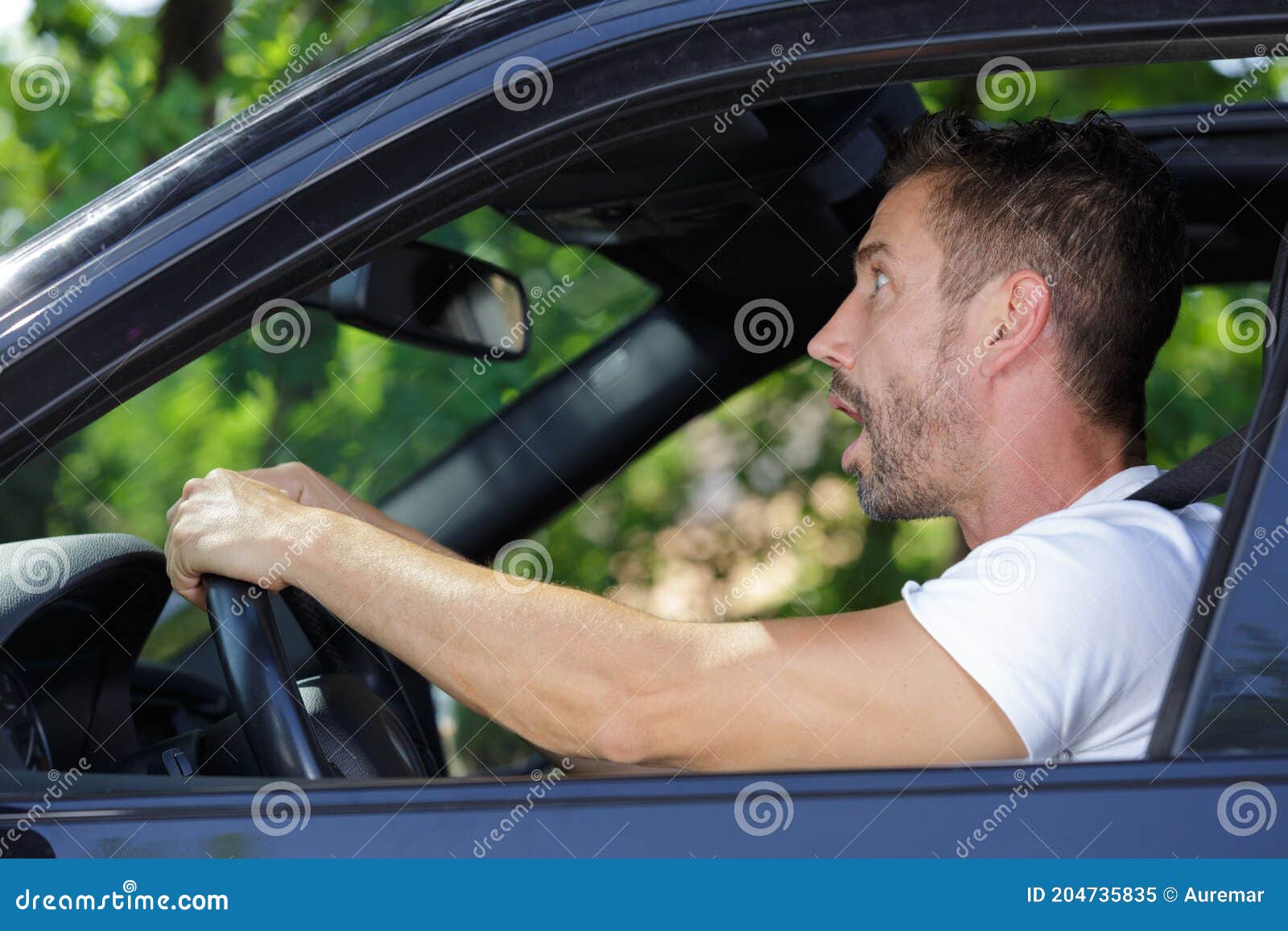 Side View Man Driving Car with Shocked Expression Stock Image - Image ...