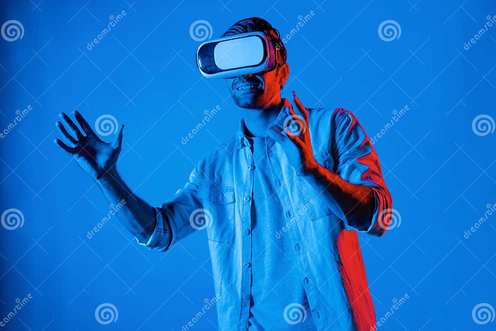 Side View of Man Holding and Moving Gesture while Using VR Goggle ...