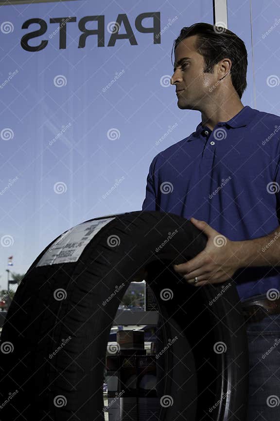 Side View of Man Holding Tire Stock Image - Image of automobile ...